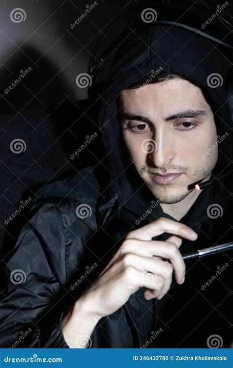Handsome Hacker In Black Hoodie Royalty Free Stock Image