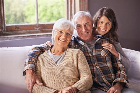 My Mom And Dad Mean The World To Me A Cropped Portrait Of A Happy Senior Couple And Their Adult