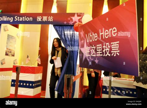 A Chinese Woman Exits The Mock Voting Booth Stock Photo Alamy