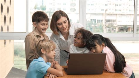 cute girl programing system while surround with teacher and friend