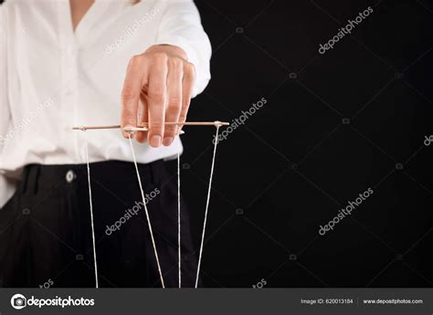 Woman Formal Outfit Pulling Strings Puppet Black Background Closeup Space Stock Photo