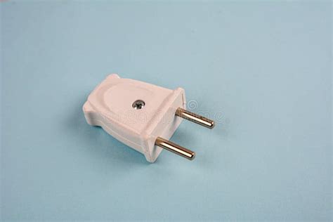 White Two Pronged Plug On A Blue Background Stock Image Image Of