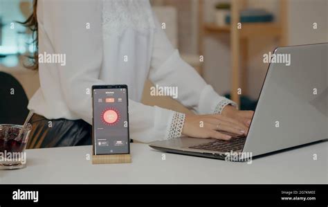 Woman Using Smart Home App With Voice Assistant Controlling Light Turning It On Talking At