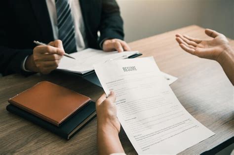 Premium Photo Midsection Of People In Job Interview On Table