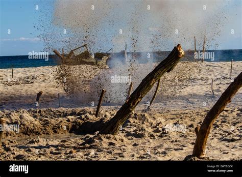 Background Bombs Exploding On The Beach Reconstruction Of Battle From