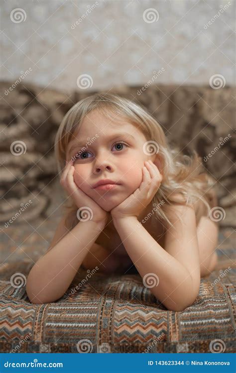 Boy 4 Years Old Is At Home Lying On The Couch And Watching Tv Portrait