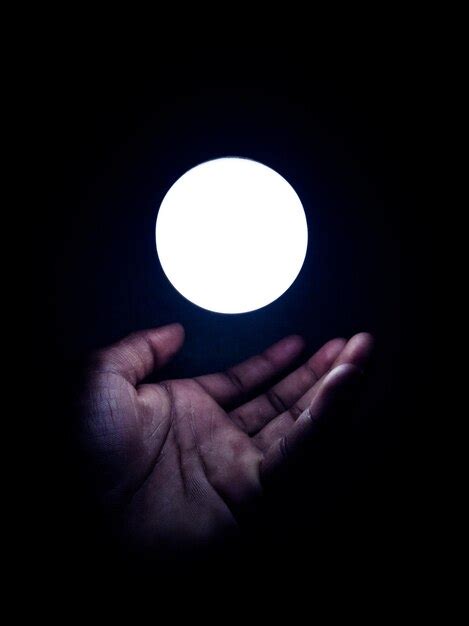 Premium Photo Cropped Hand Holding Illuminated Light