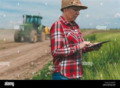 Smart Farming Using Modern Technology In Agricultural Activity Female Farmer Agronomist With