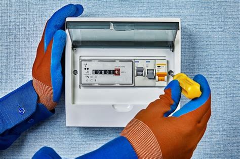 Premium Photo Cropped Hands Fixing Fuse Box