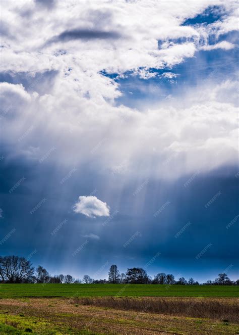 Premium Photo Amazing Clouds Rays Of Light Pass Through A Huge Cloud