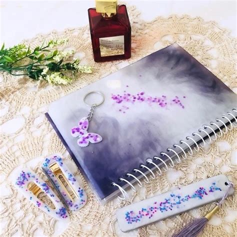 خرید و قیمت دفتر رزینی سیمی بنفش با ست بوک مارکنشانگر کتاب و گیره و