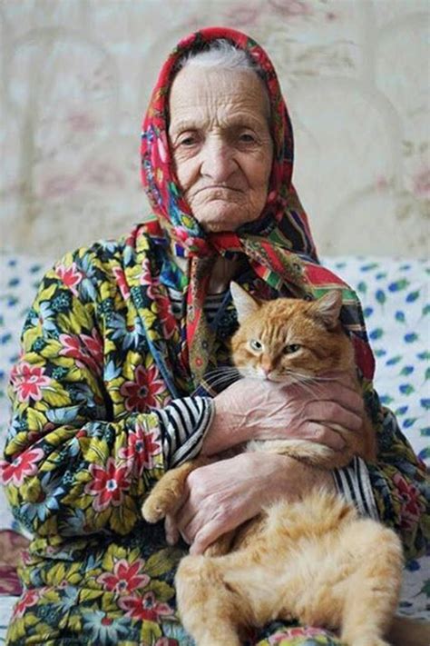 Download Old Woman With A Cat Wallpaper