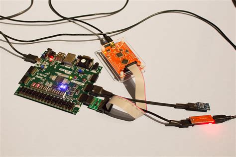 mipsfpga allows loading programs via uart and has a switchable clock