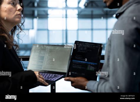 Programmers In Data Center Using Devices Executing Security Patches Verifying Firewall