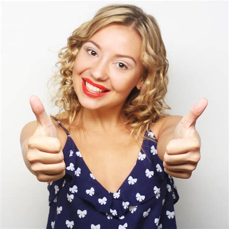 Premium Photo Young Woman Showing Thumbs Up Gesture