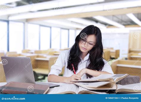 Beautiful Female Student Doing Assignment In Class Stock Image Image