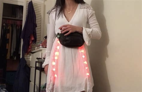 this maker designed an interactive led lit dress inspired by katniss