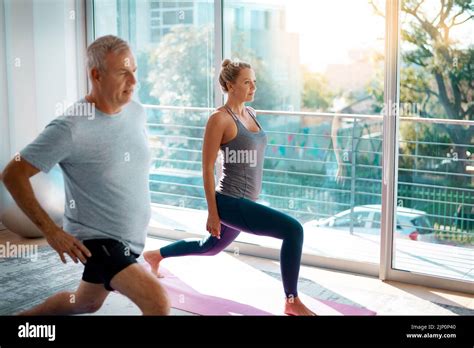 Stretch Properly Avoid Injury A Mature Couple Stretching On Yoga Mats