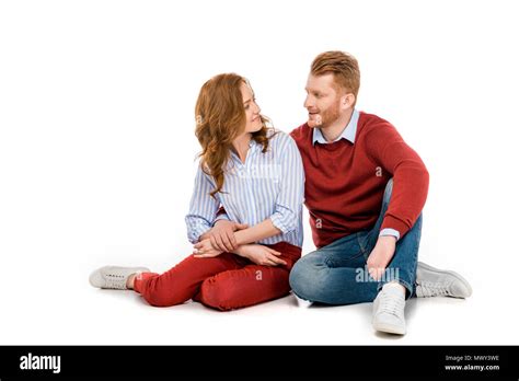 Beautiful Happy Redhead Couple Sitting Together And Smiling Each Other
