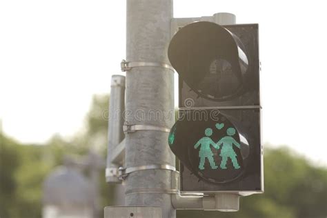 A Pedestrian Traffic Light Shows A Green Graphic Of A Loving Same Sex Lesbian Women Couple In