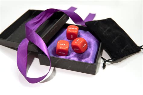 Premium Photo Cubes For Sex Games In The Black Box With Purple Ribbon Sexy Romantic T