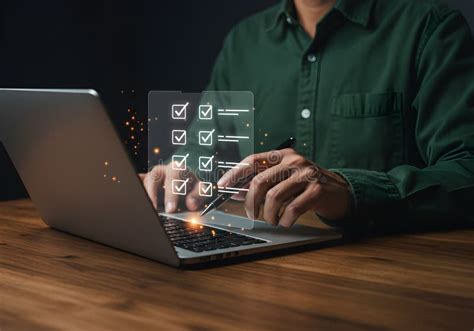 Man Checking Digital Checklist On Laptop For Task Management And