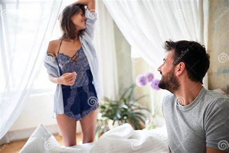 Young Couple In Underwear Having A Foreplay In Bed In The Morinig On