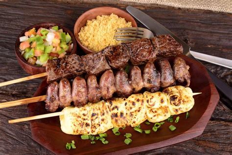 Download Delicious Churrasco Grilled On Skewers Wallpaper
