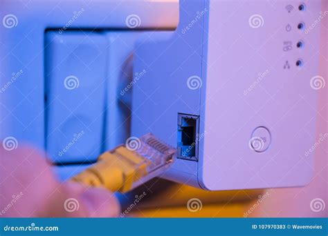 Man Insert Ethernet Cable Into WiFi Extender Device Which Is In Stock Image Image Of Male