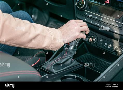 Woman S Hands Are Shifting Her Gear Knob In Her New Modern Car Stock Photo Alamy