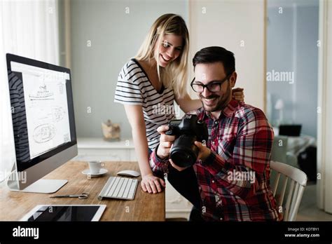 Beautiful Woman And Attractive Man Doing Design Work Stock Photo Alamy