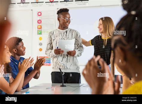 High School Students Clapping For Classmate In Debate Class Stock Photo Alamy