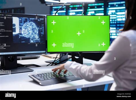 Programmer Doing Checkup On Green Screen Computer In Server Room Used