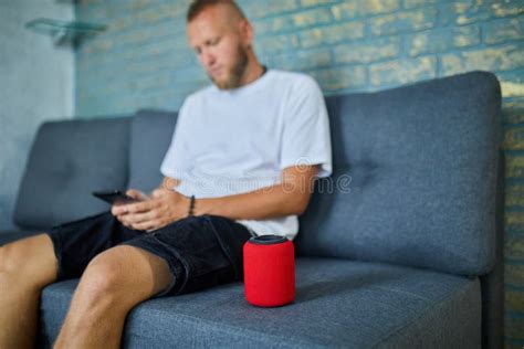 Male Testing Talking Smart Wireless Speaker Man Controlling Home Devices With A Voice Commands