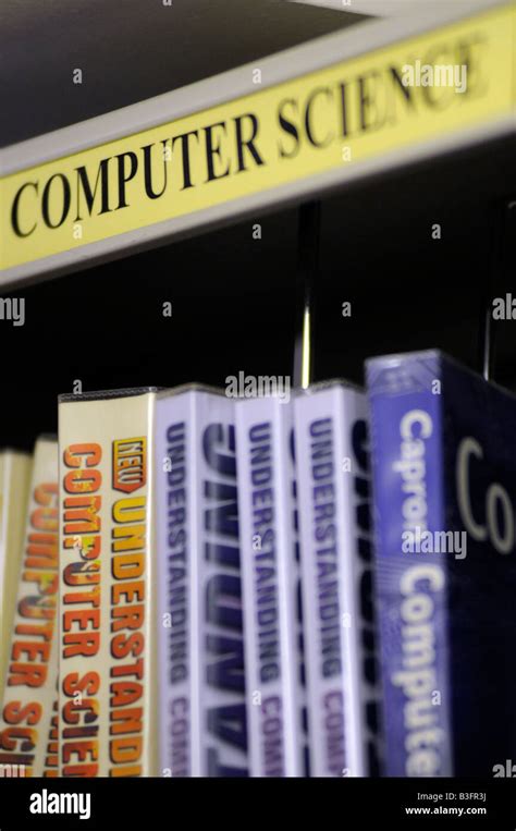 royalty free photograph of computer science section in college library
