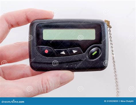 Pager In Close Up An Old Retro Communication Device In Female Hand On
