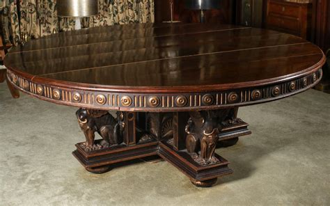 29 A Massive Carved Oak Dining Table With Female Sphinx