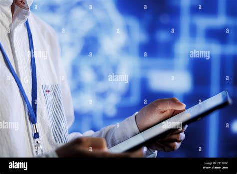 computer scientist writes code on tablet to visualize artificial