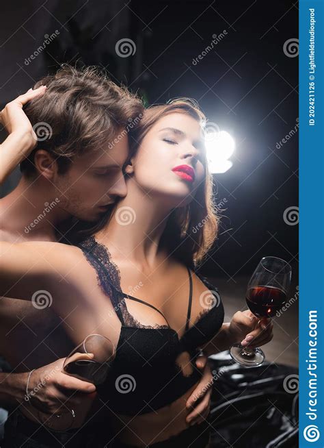 Man With Glass Of Wine Kissing Stock Photo Image Of Light Glasses