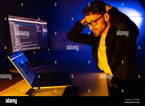 photo of serious professional programmer look camera improving