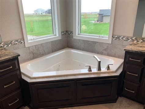 Beautiful Tile Accent Running The Lenth Of The Bathroom Really Brings