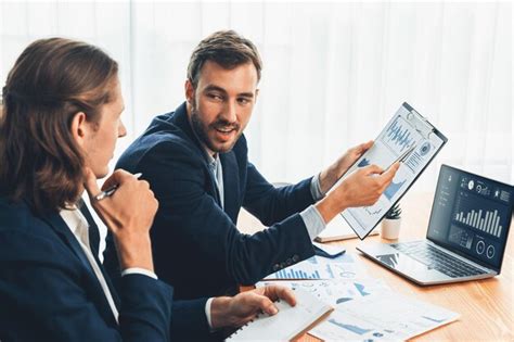 Premium Photo Busy Analyst Team In Office Analyzing Financial Data