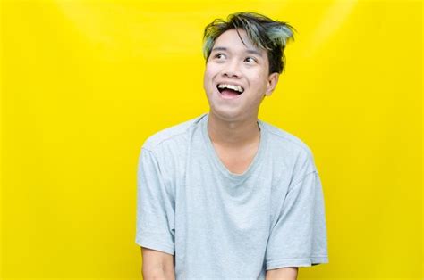 Premium Photo Crazy Happy Asian Man With Funny Hairstyle Making