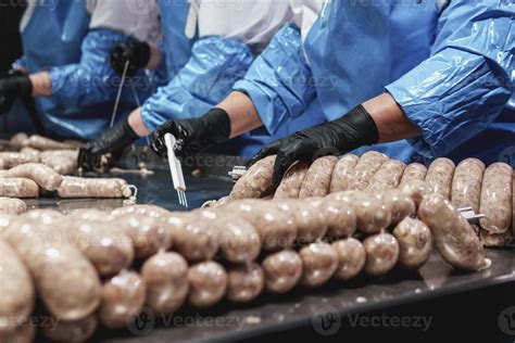 Close Up Of Sausages Production Process At The Meat Factory Concept Of