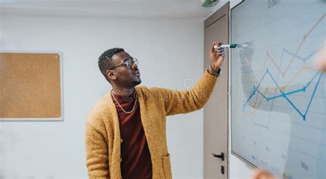 Confident Businessman Presenting Growth Chart In Office Meeting Filmed