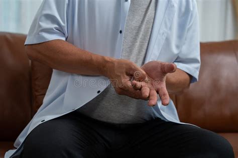 Elderly Asian Male Patients Suffer From Numbing Pain In Hands From