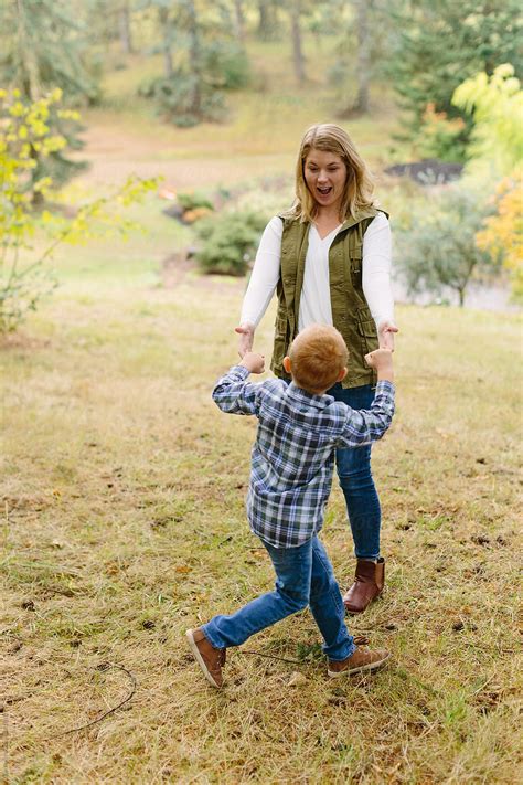 Mom Spinning With Son In Park By Stocksy Contributor Leah Flores Stocksy