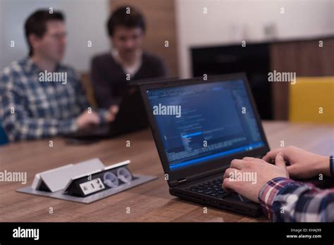 Software Developer Writing Programming Code On Laptop Computer Stock
