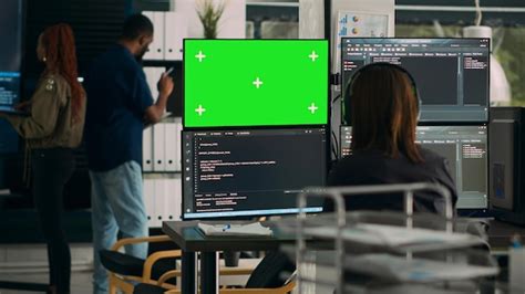 premium photo software developer analyzing greenscreen and server