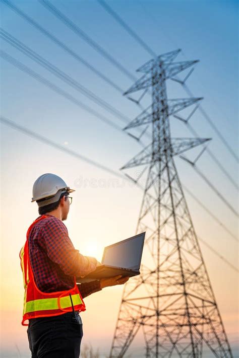 Asian Electrical Engineers Checking Location Using A Notebook Computer